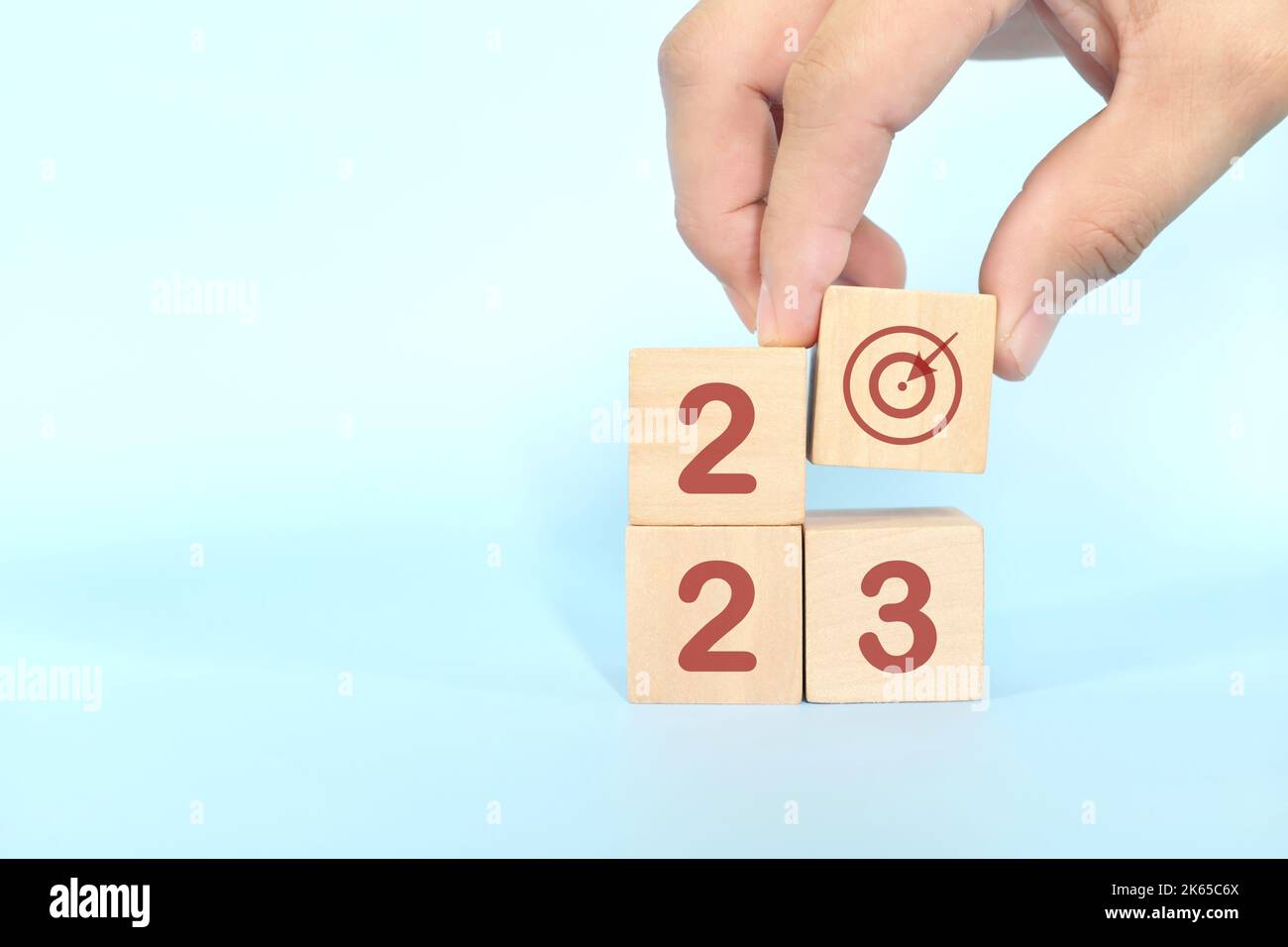 Start New Year 2023 business target goal concept. Human hand stacking ...