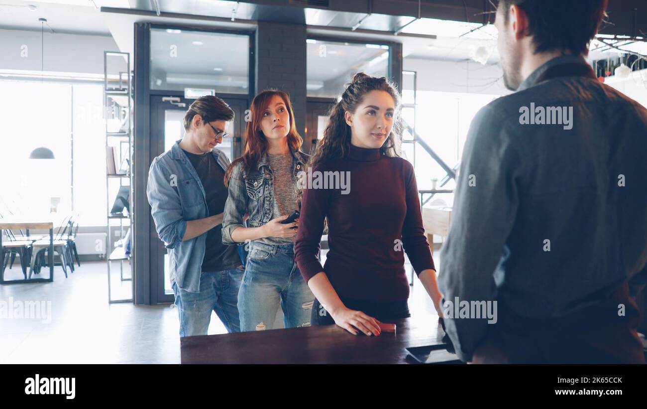 Waiting in checkout line phone hi-res stock photography and images - Alamy