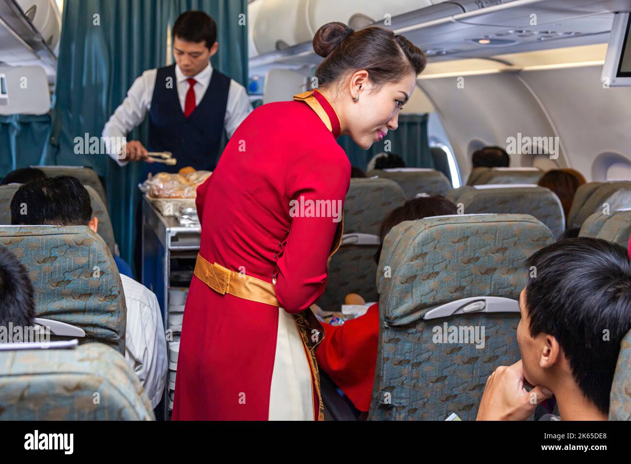 Flight crew and passengers on board Vietnam Airlines flight from Hanoi ...