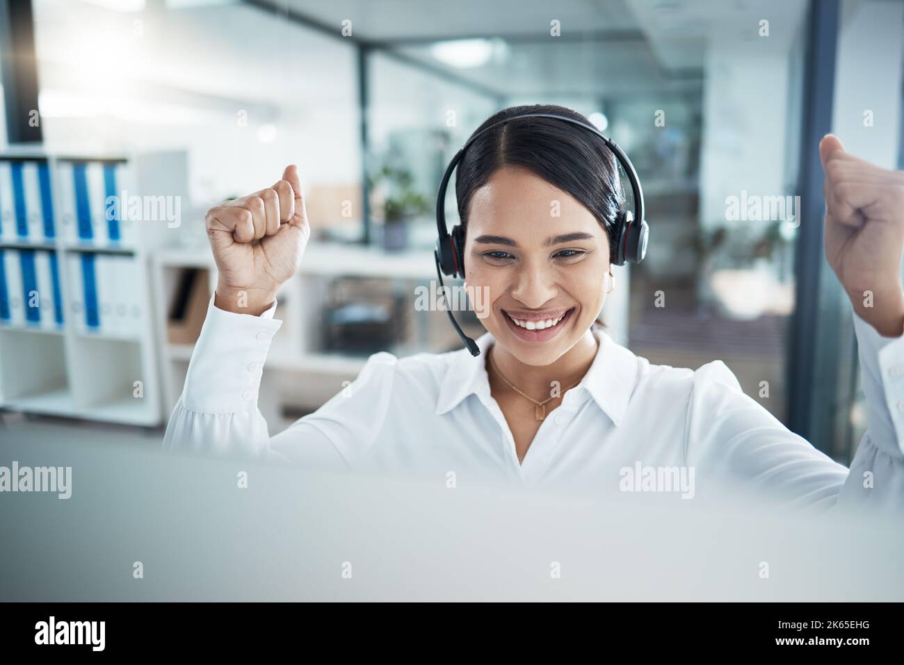 Call center, success and employee in celebration, consulting and ...