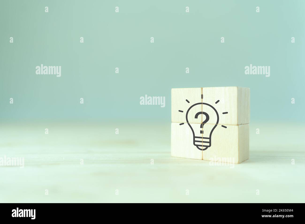 Question marks and light bulb symbolizing idea or solution. Problem solving skill, creativity ...