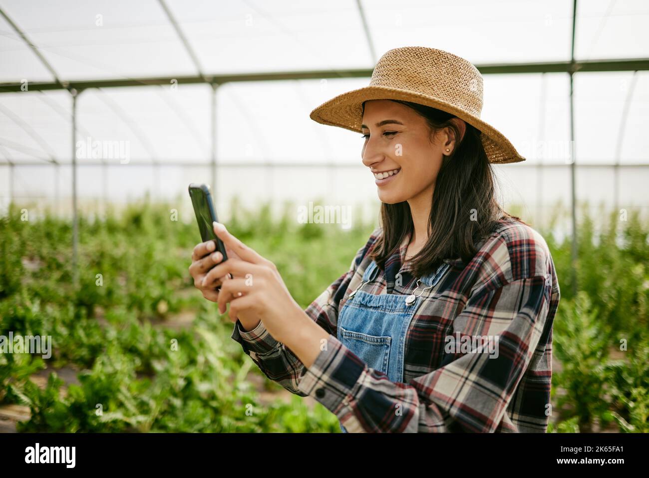 Just a few snaps for the gallery. a young female farmer taking a photo ...