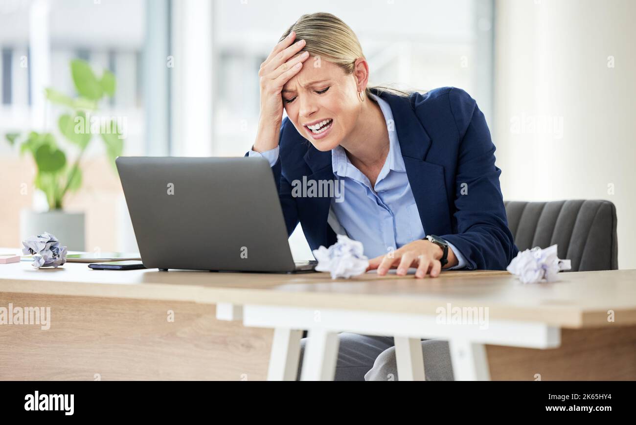 Stressed Caucasian call center agent with a headache. Businesswoman ...