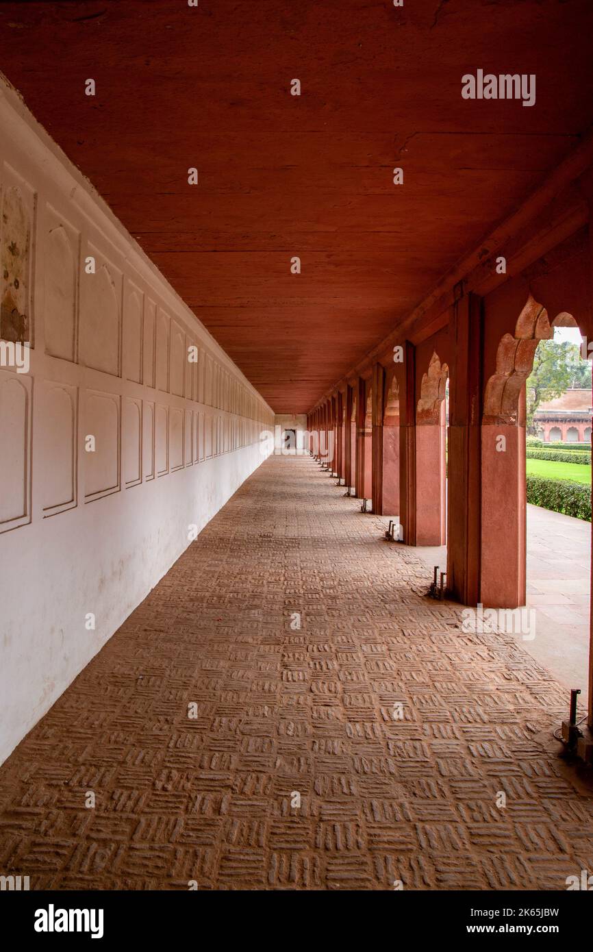 A vertical shot of the architecture and empty hallway of Agra Fort in ...