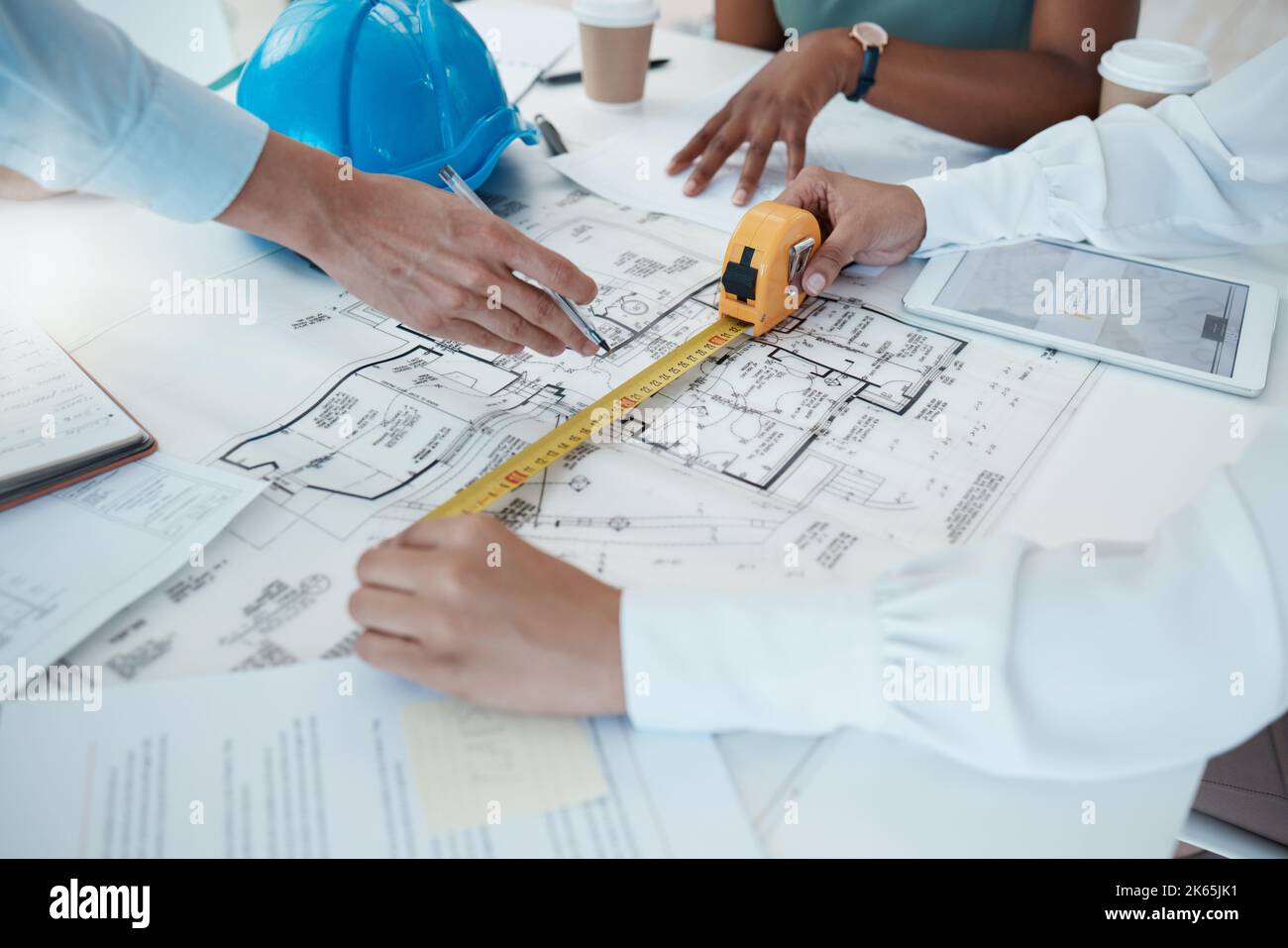 Architecture hands, blueprint design and tape measure for construction ...