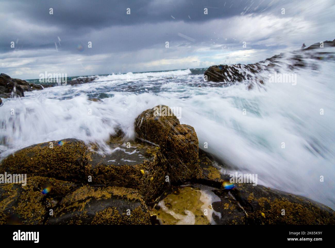 Waves crashing onto Giant's Causeway rocks in Northern Ireland, United ...
