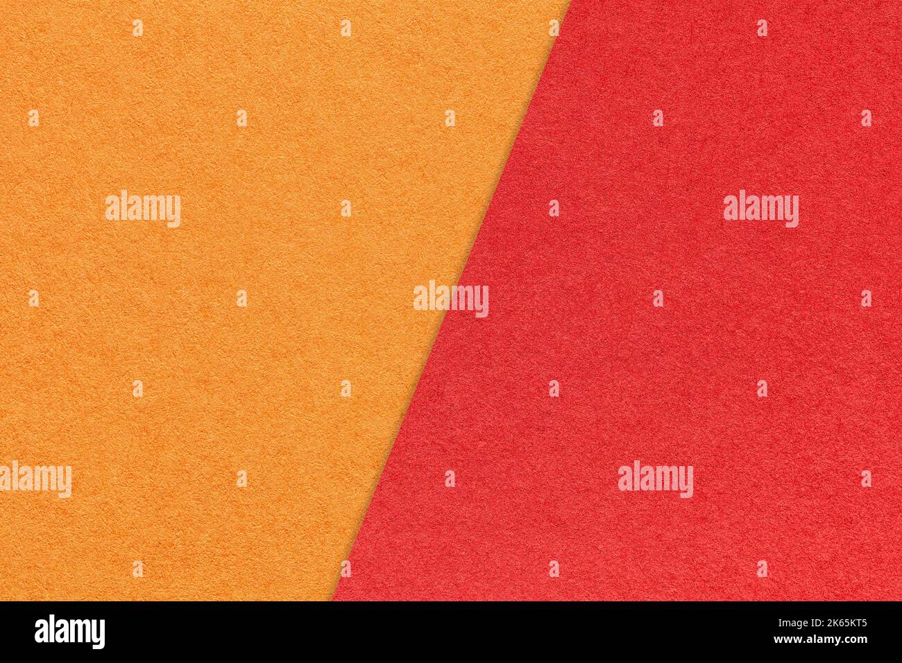 Texture of craft bright orange and red paper background, half two ...