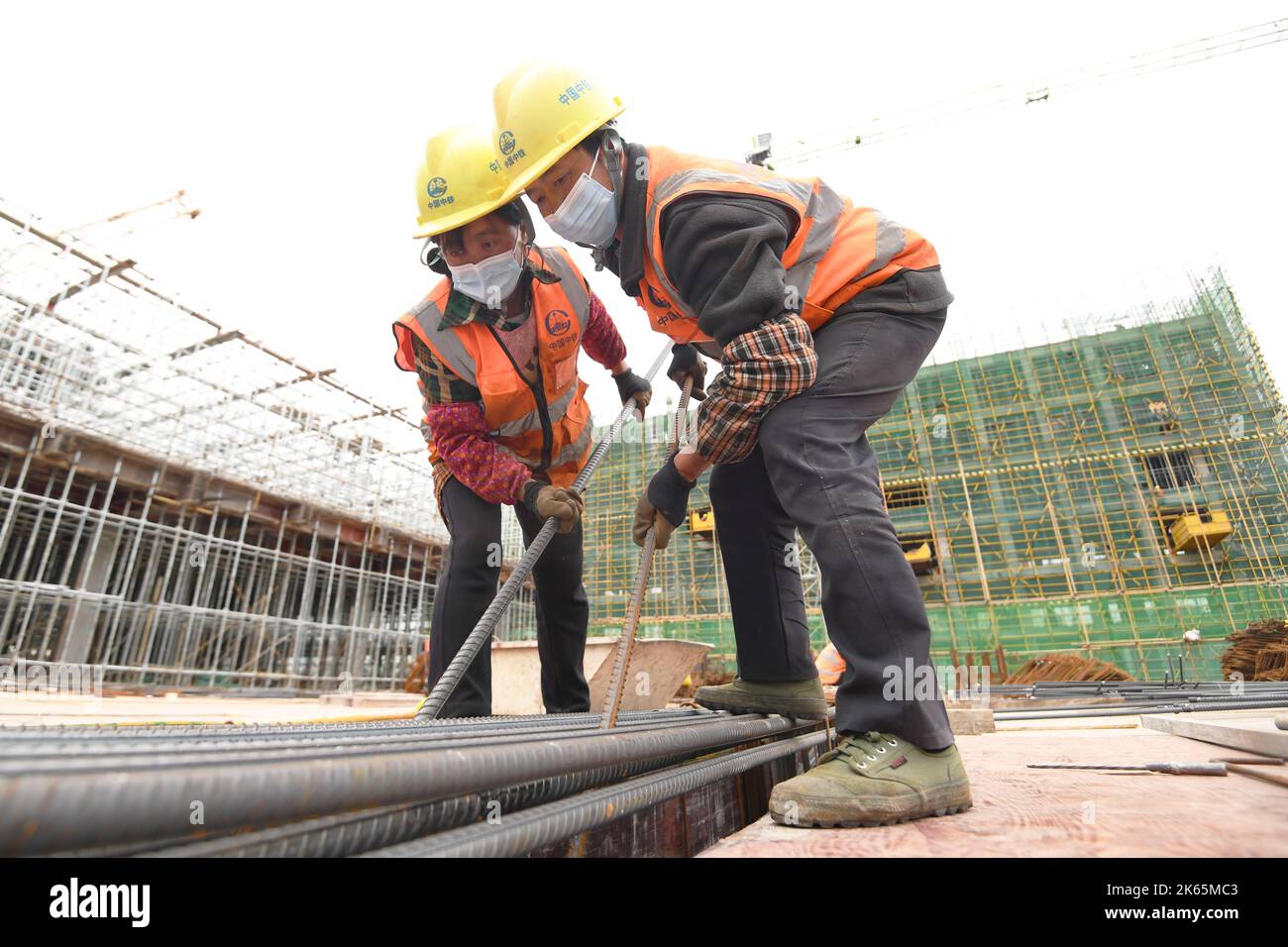 GUIYANG, CHINA - OCTOBER 12, 2022 - A construction worker straps steel ...