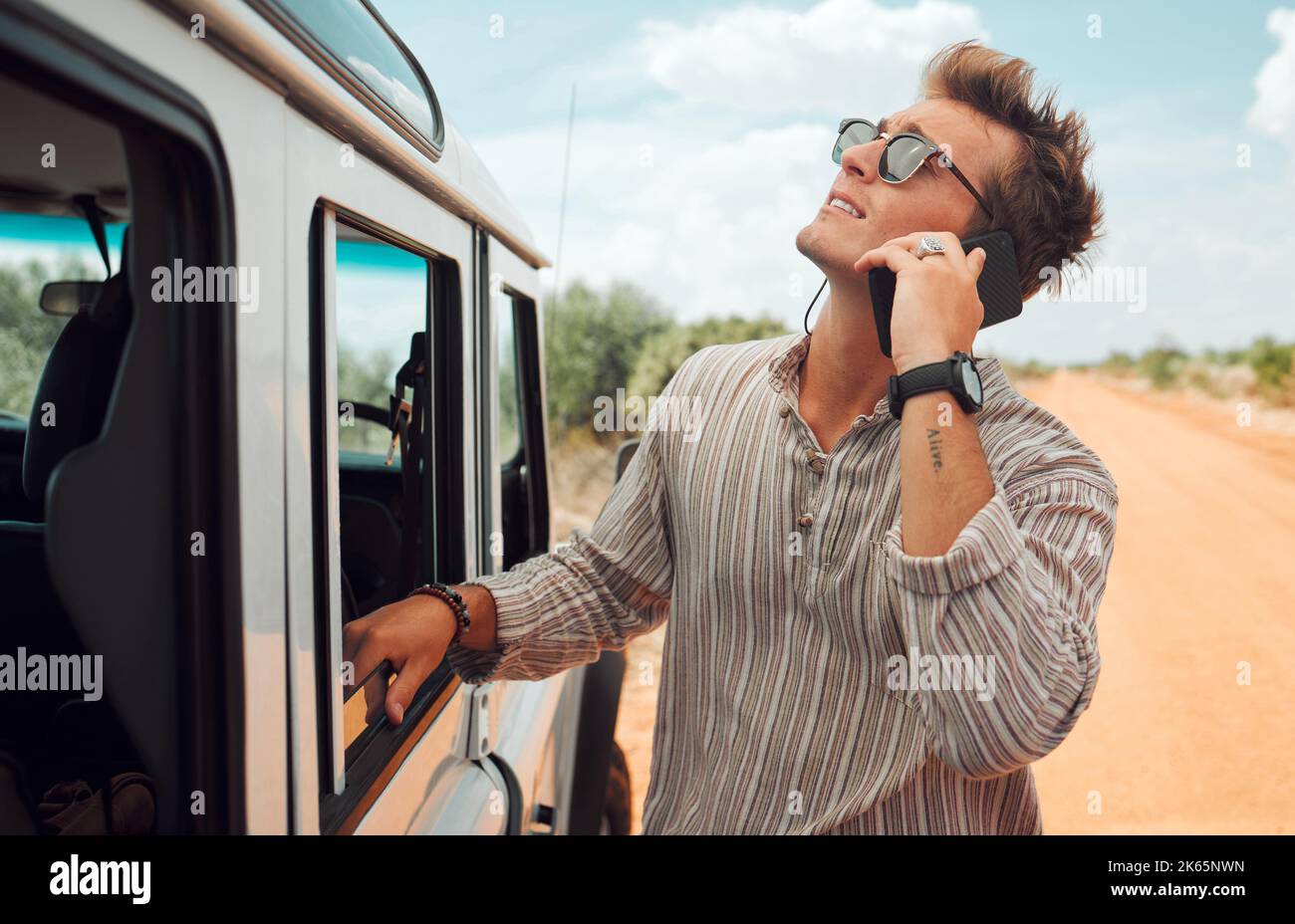 Phone, road trip and vehicle breakdown with a man on a call for ...