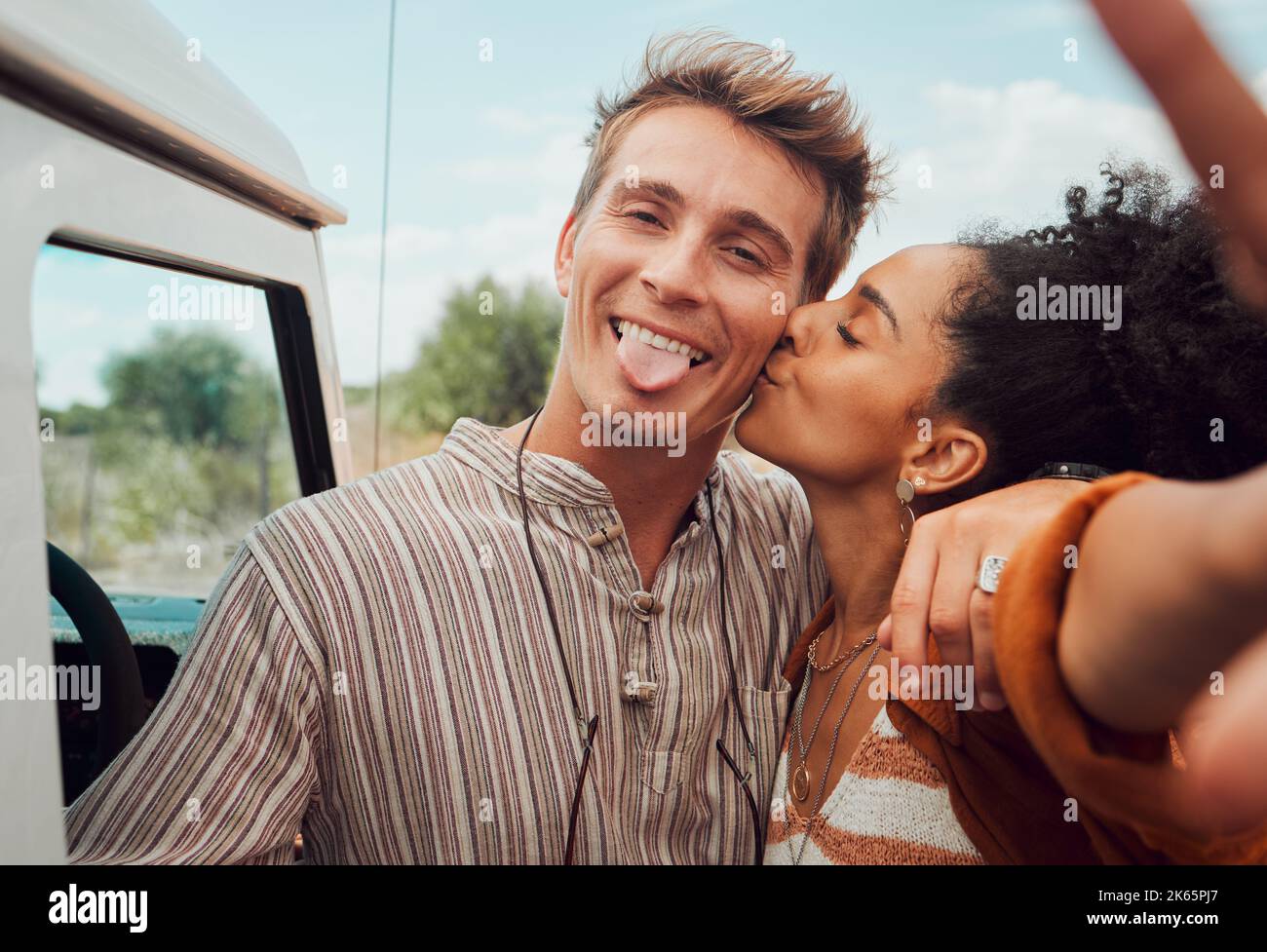 Selfie Kiss And Couple Taking A Picture On A Road Trip Having Fun On