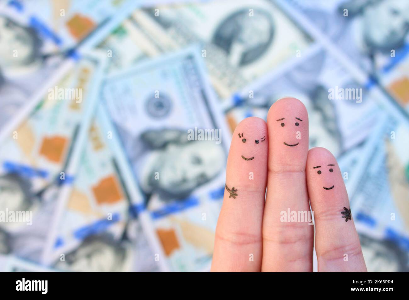 Fingers art of family on background of money Stock Photo - Alamy