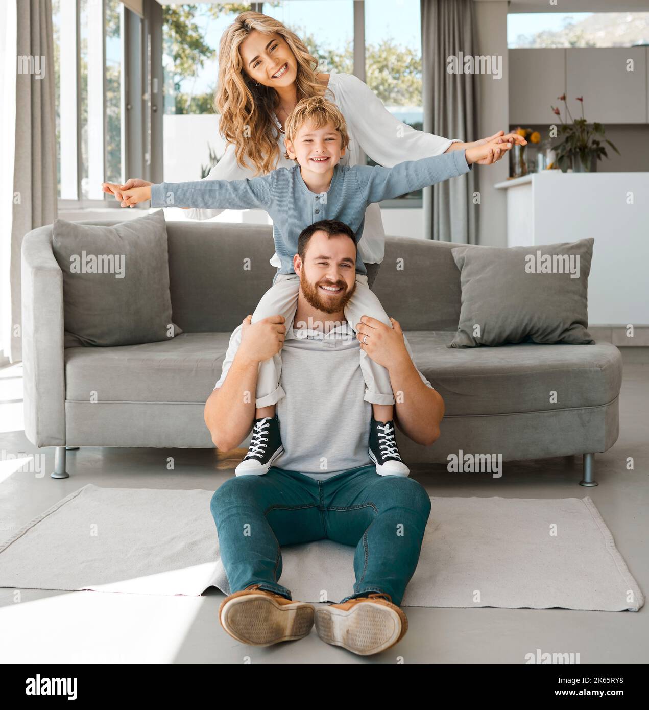 Portrait of a happy family. Parents and son at home. Adorable caucasian ...