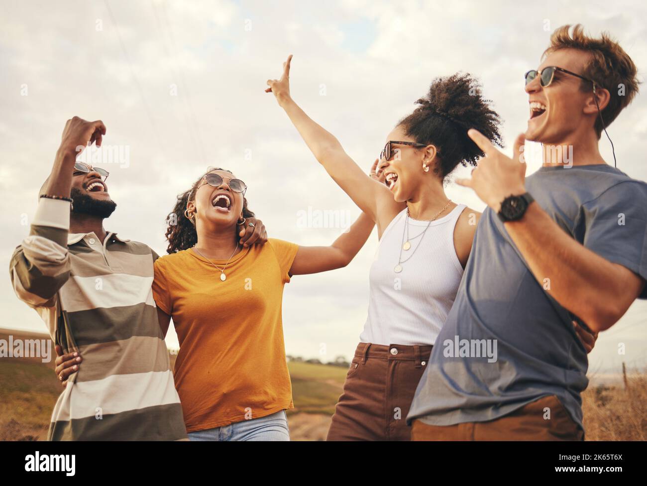 Friends, freedom and fun with a man and woman group laughing or joking ...