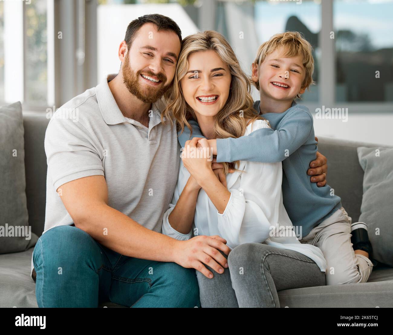 Portrait of happy parents and their little son at home. Adorable ...