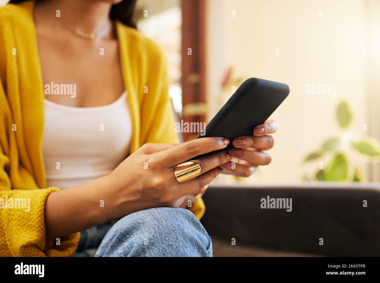 Woman networking on cellphone typing hi-res stock photography and ...