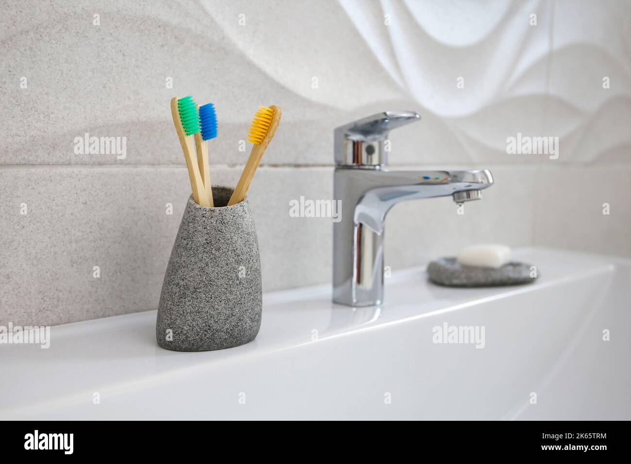 Wooden toothbrushes in the bathroom Stock Photo - Alamy