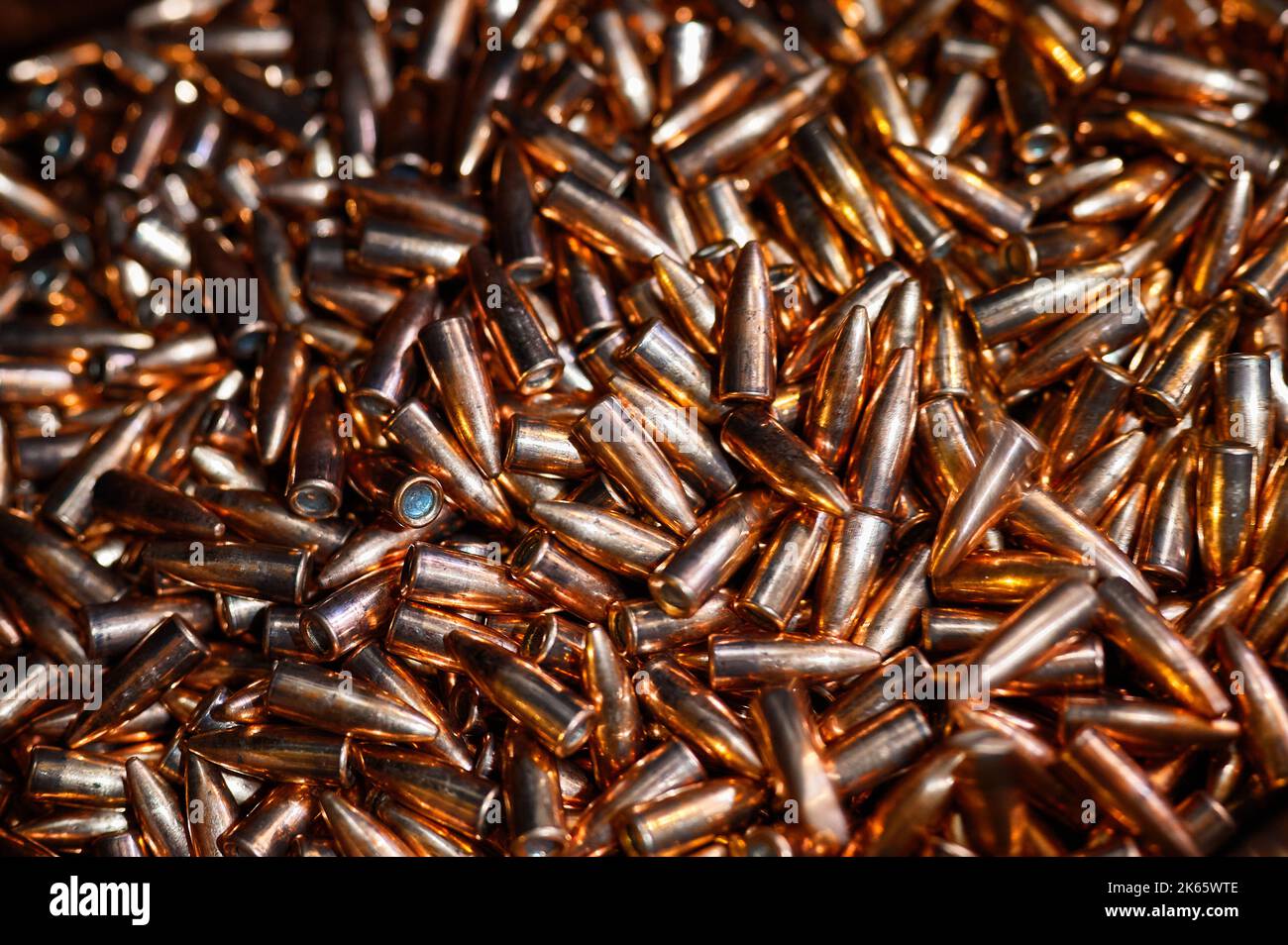 Large caliber copper shells pile for riffle as background Stock Photo ...
