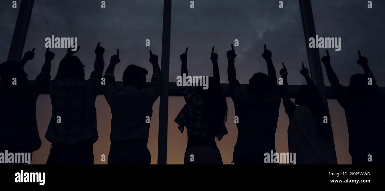 in full growth. business team pointing up Stock Photo - Alamy