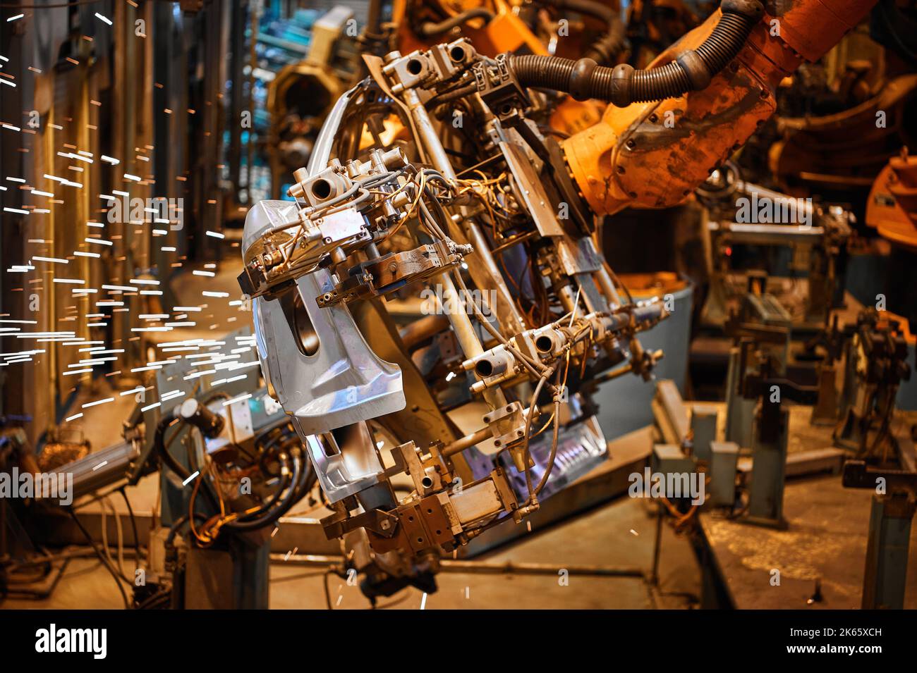 Modern robot welder processes metal part in factory workshop Stock ...