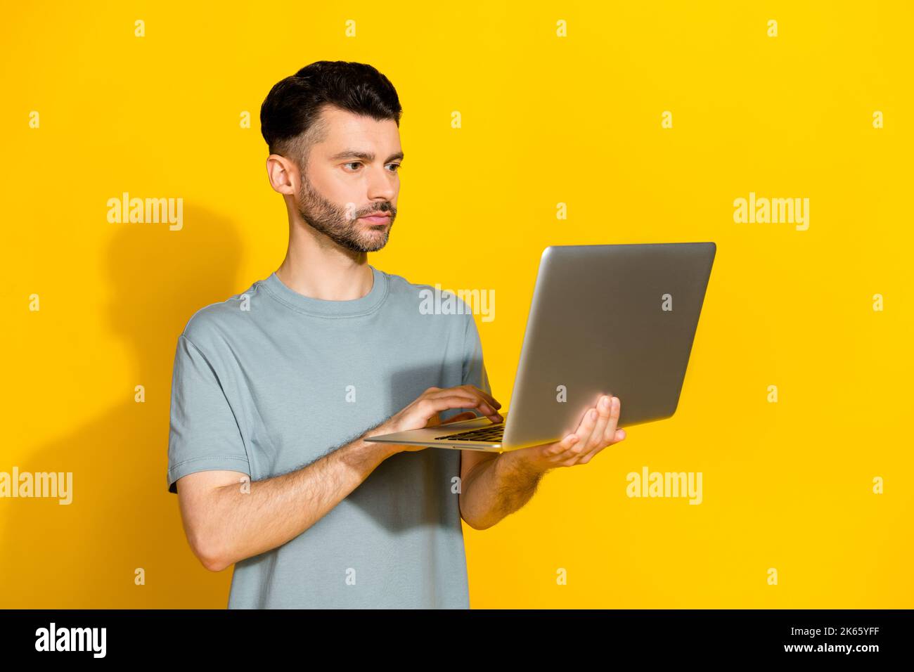 Photo of serious confident professional businessman hold new netbook ...