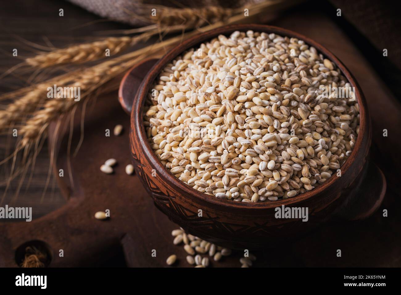 Bowl of raw dried broken pearl barley cereal grain Stock Photo - Alamy