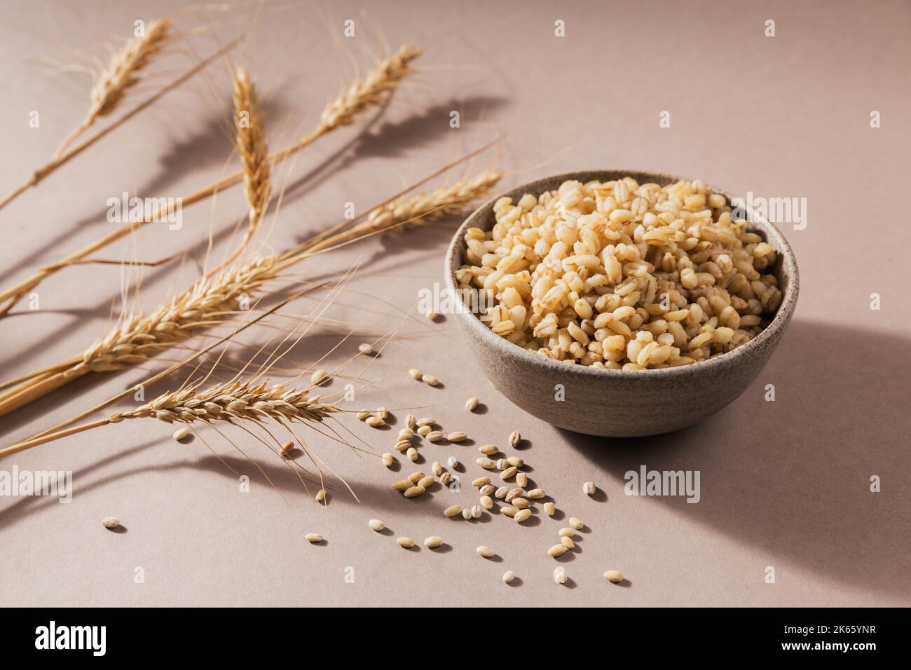 Bowl of cooked peeled barley grains porridge Stock Photo - Alamy