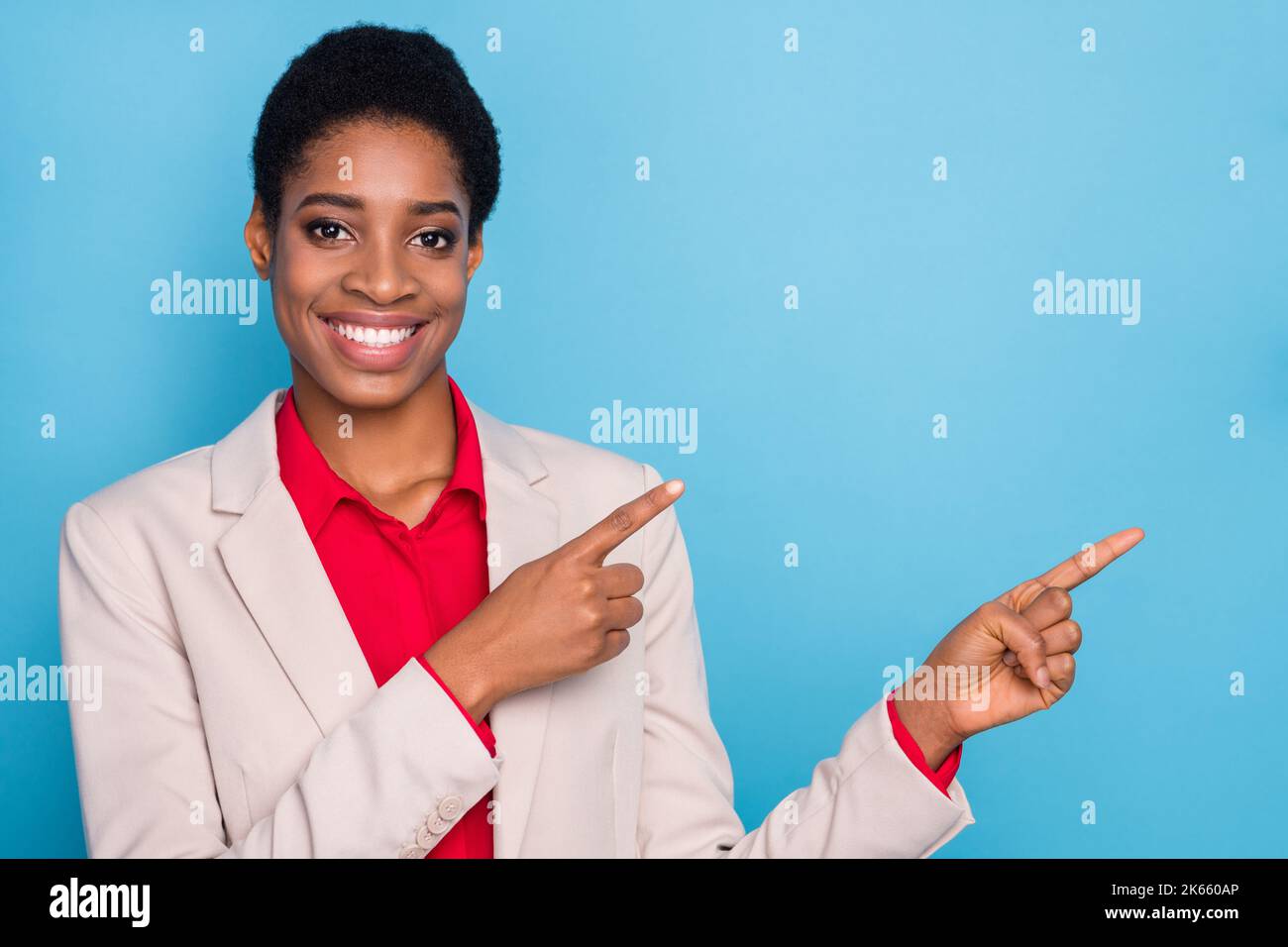 Portrait of positive person indicate fingers empty space wear blazer ...