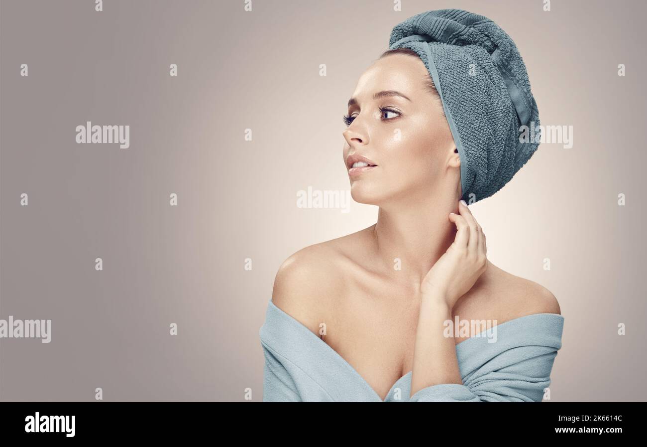 Beautiful woman with perfect skin after shower, wearing bathrobe and ...