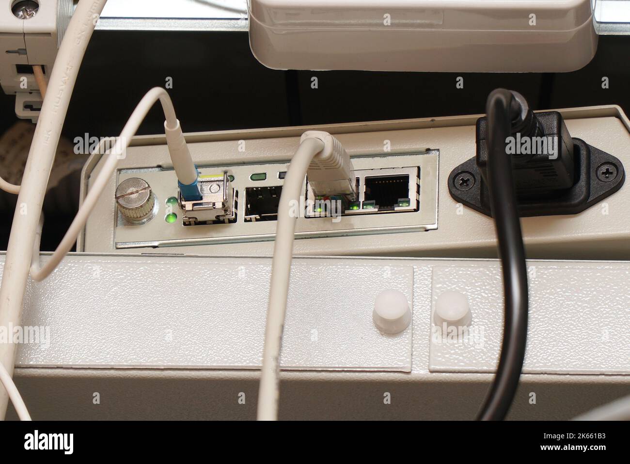 Network computer cables connected to a router or modem in the office ...