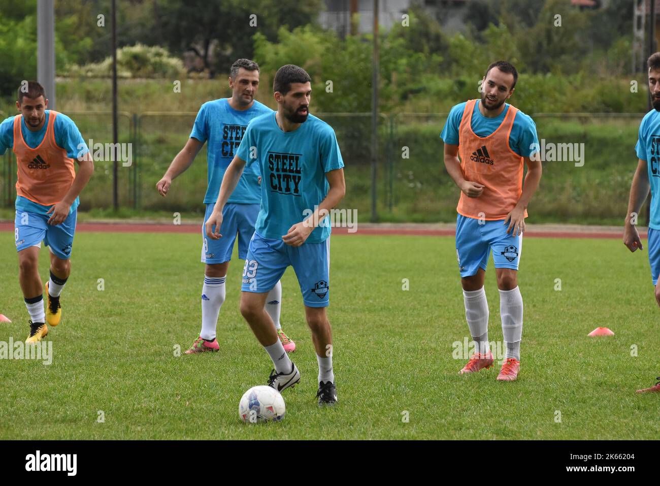 A group of football players playing on a field Stock Photo - Alamy