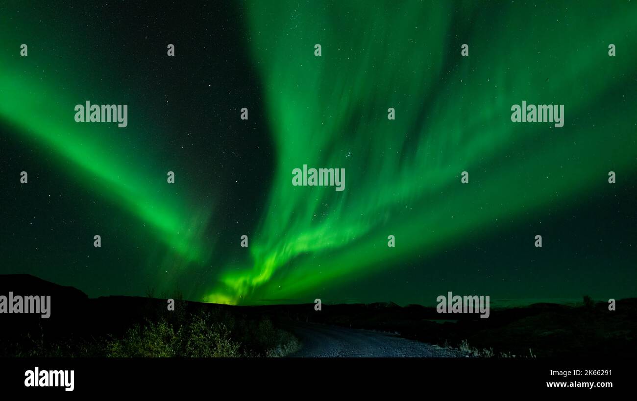 Northern lights green ray lights over track Stock Photo - Alamy