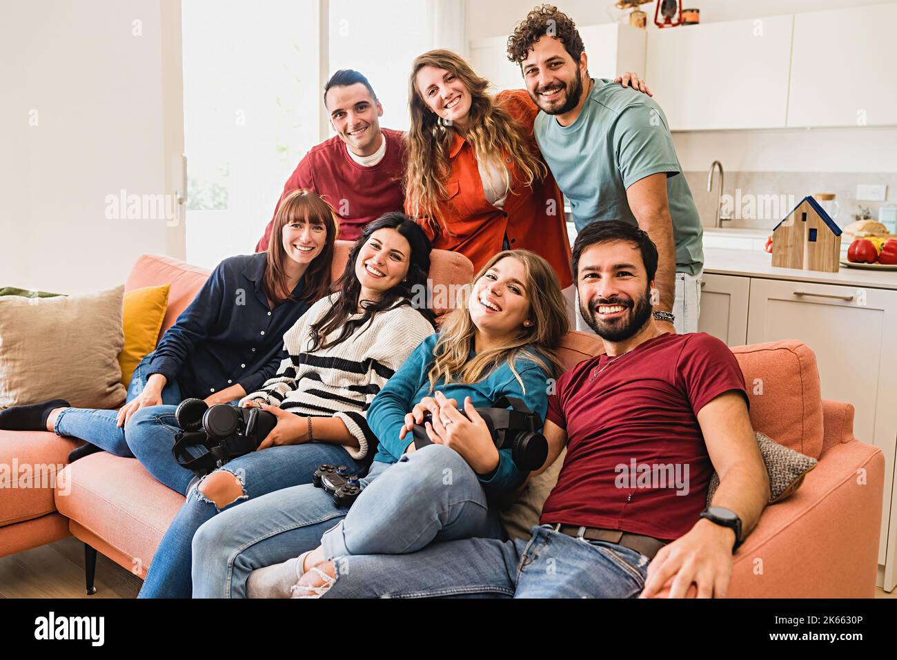 Group portrait of happy friends posing for picture at home smiling ...