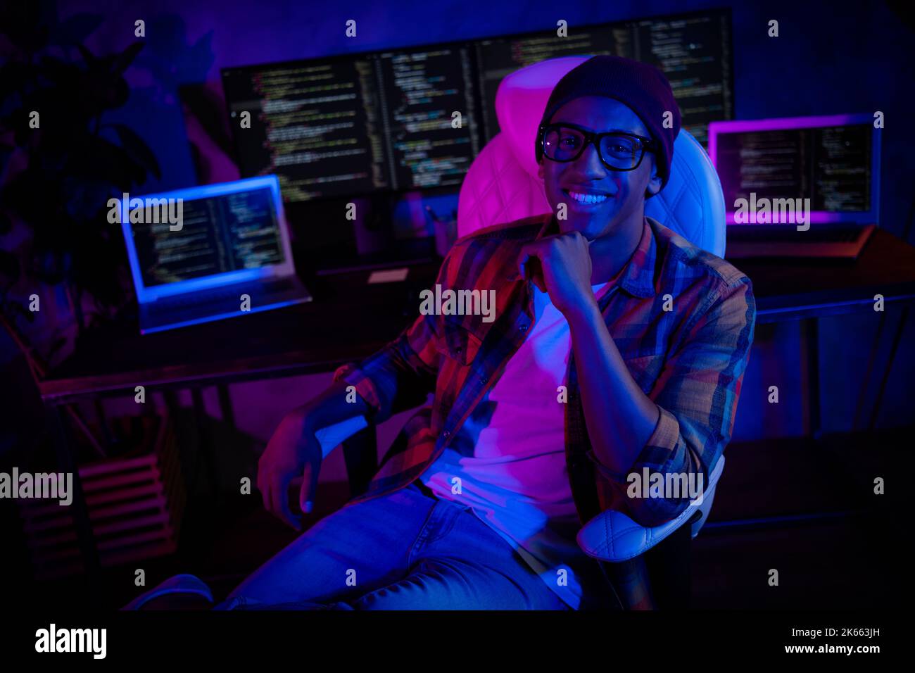 Photo of positive intelligent web designer sitting chair night shift ...