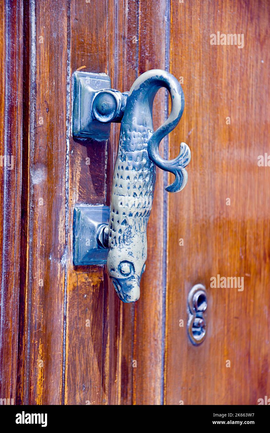 old metallic fish door knocker Stock Photo - Alamy