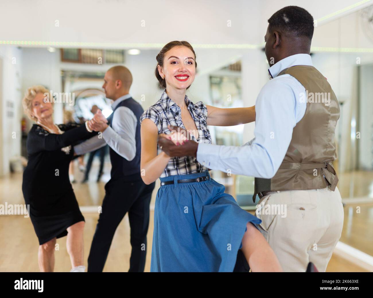 Man and woman performing jazz dance in dancing room Stock Photo - Alamy