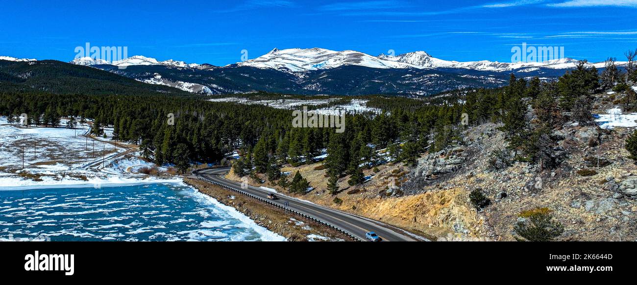 A beautiful mountainous landscape with a frozen lake outside of ...