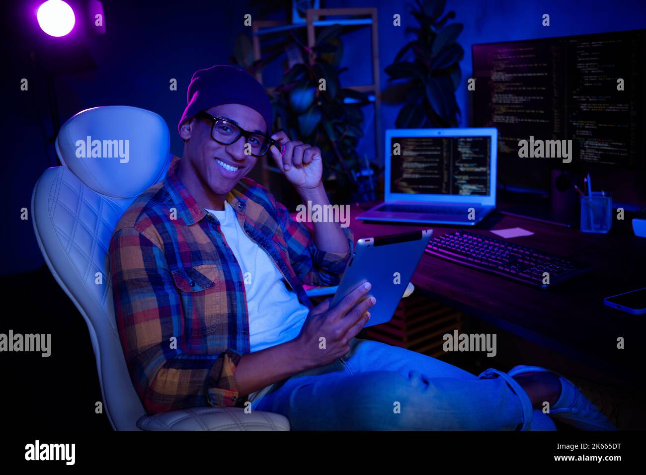 Profile photo of positive hacker sit chair use tablet operating ...