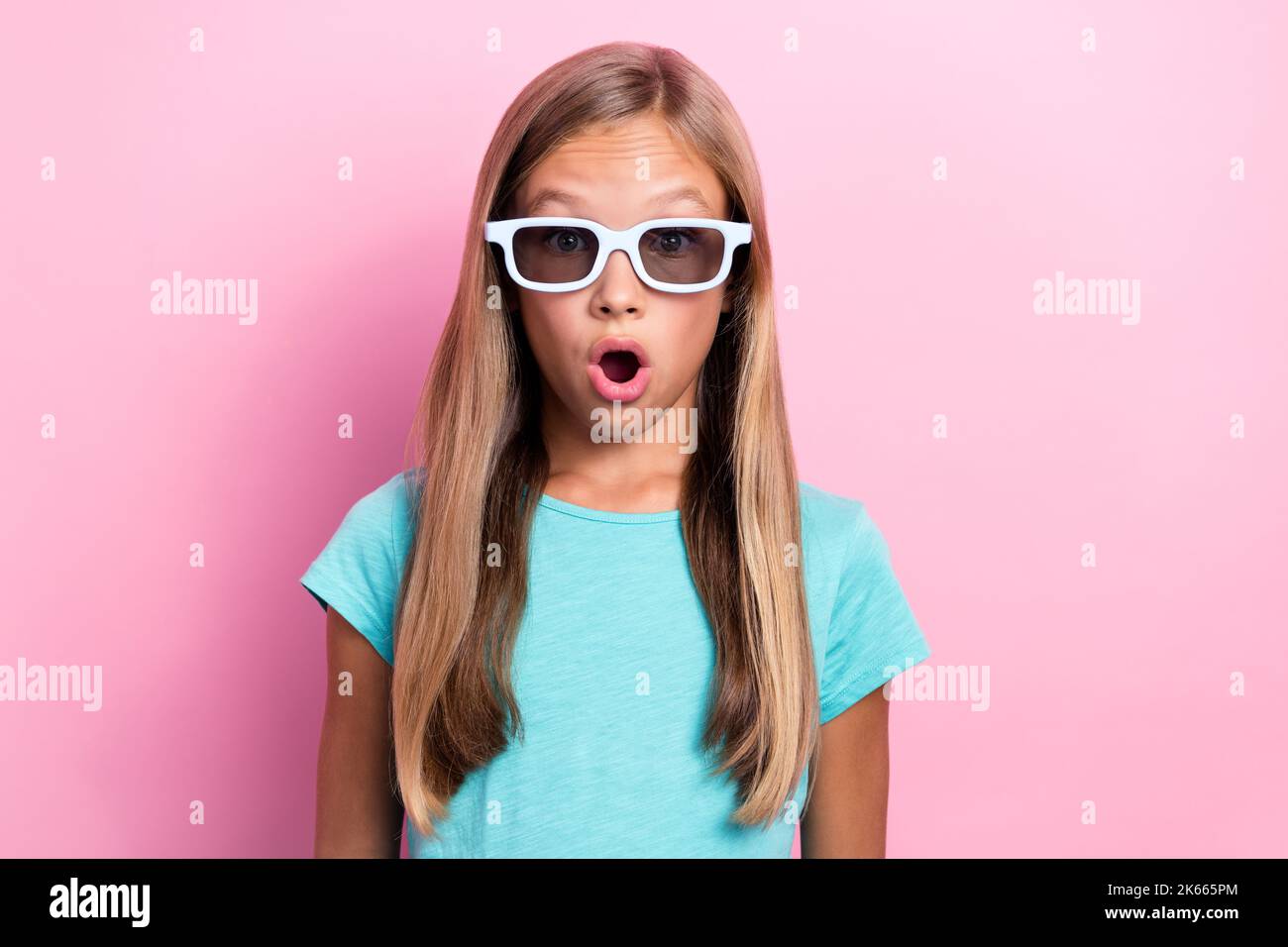 Photo of shiny impressed little child dressed teal t-shirt dark eyewear ...