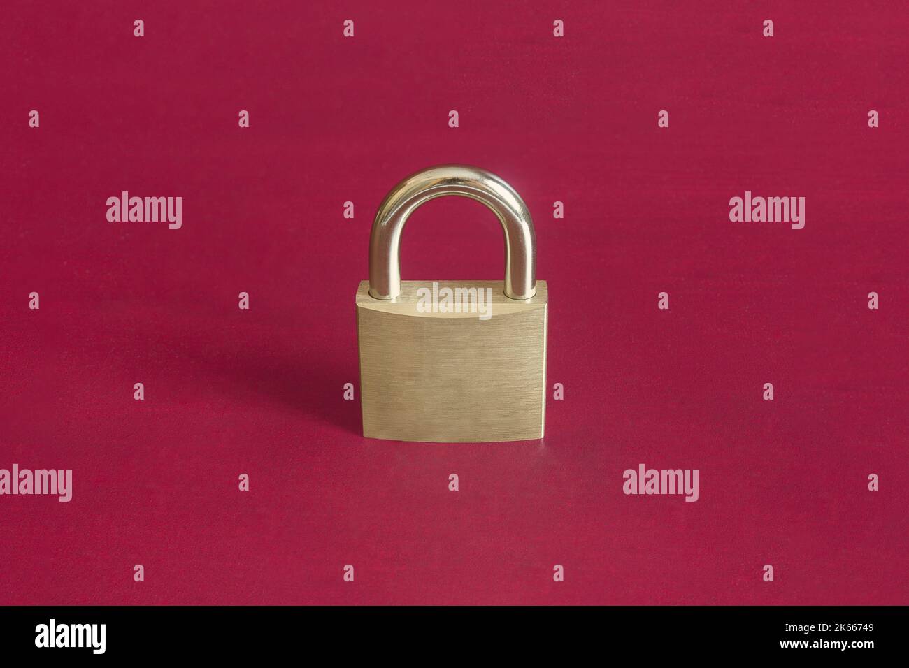 Two golden keys are joined by a metal ring on a colorful studio ...