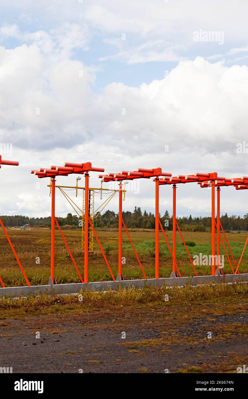 orange sticks and scaffolding at the beginning of the airport near the ...