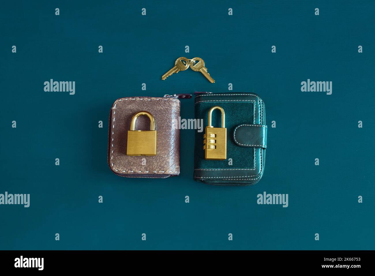 Two elegant and classic vintage wallets with a golden padlock on top of ...