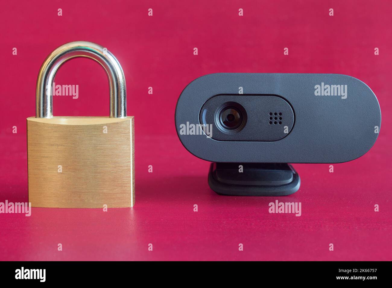 Close-up of a wireless webcam next to a closed old-fashioned gold ...