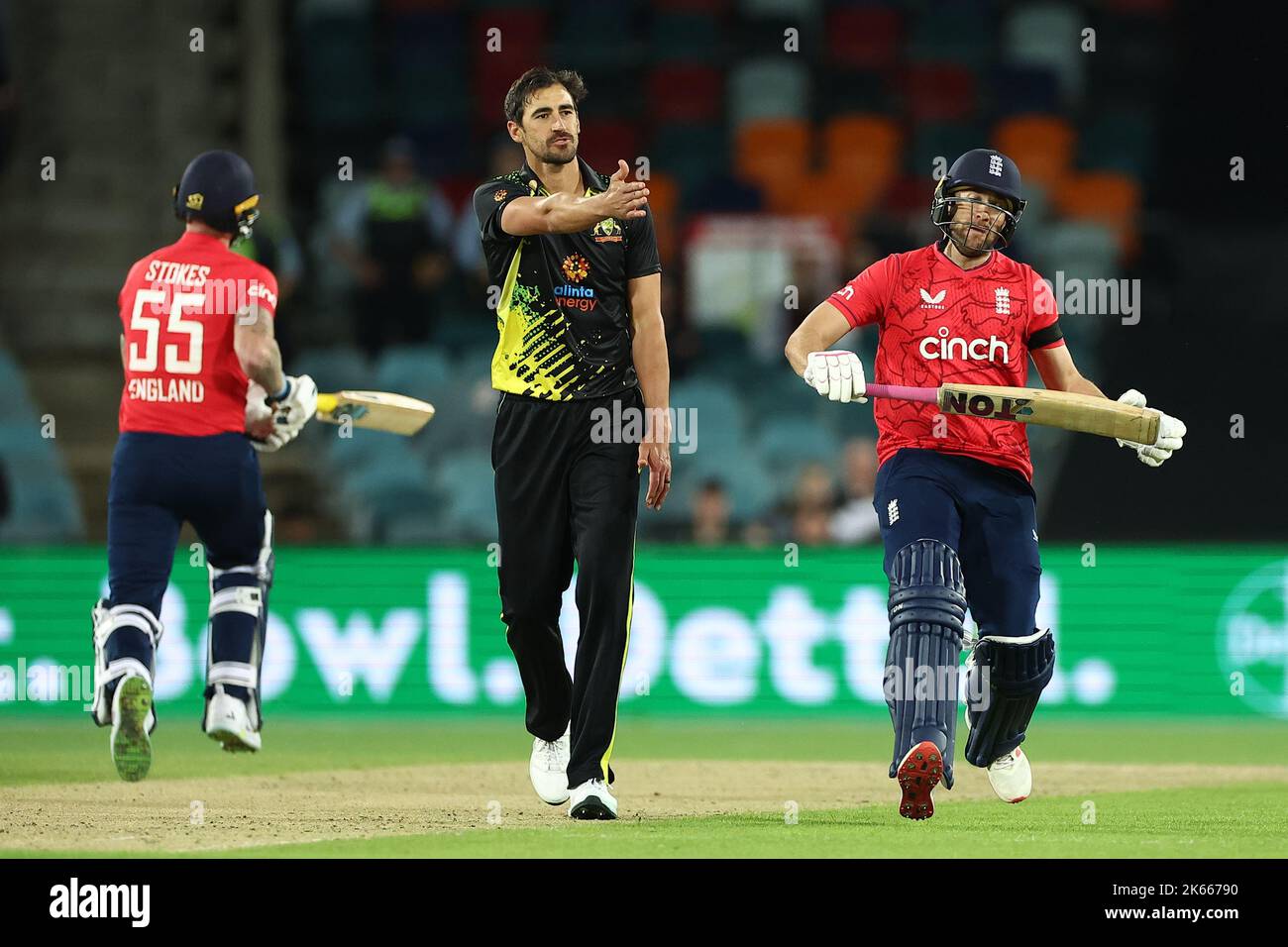 Mitchell Starc of Australia is seen with Dawid Malan of England during ...