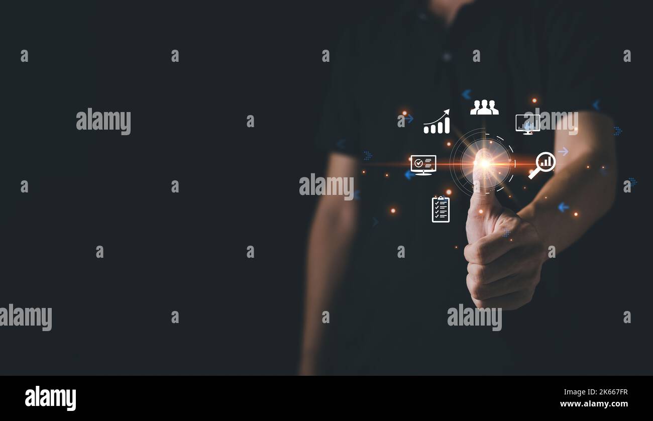 Man touching futuristic digital processing of biometric identification fingerprint scanner for ...