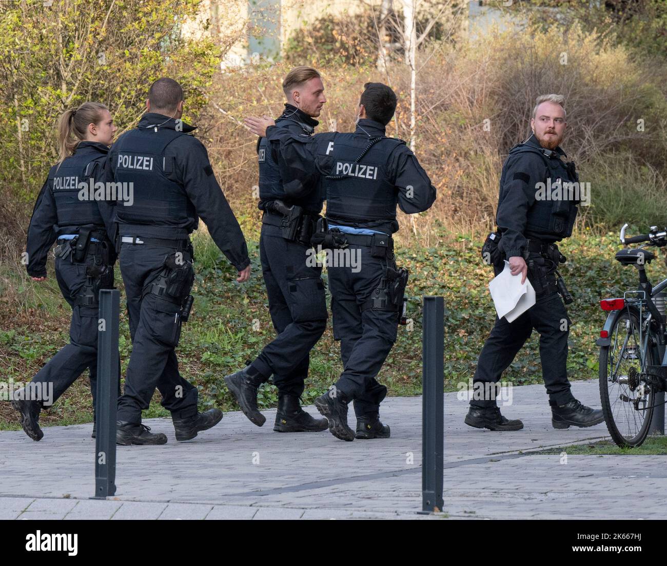 12 October 2022, Hesse, Frankfurt/Main: Police officers patrol the ...