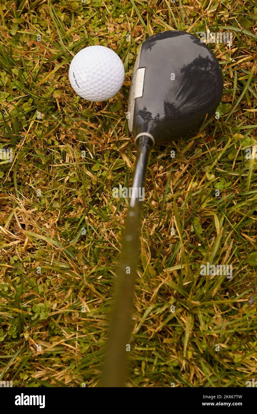 Detail of golf club hitting a ball Stock Photo - Alamy
