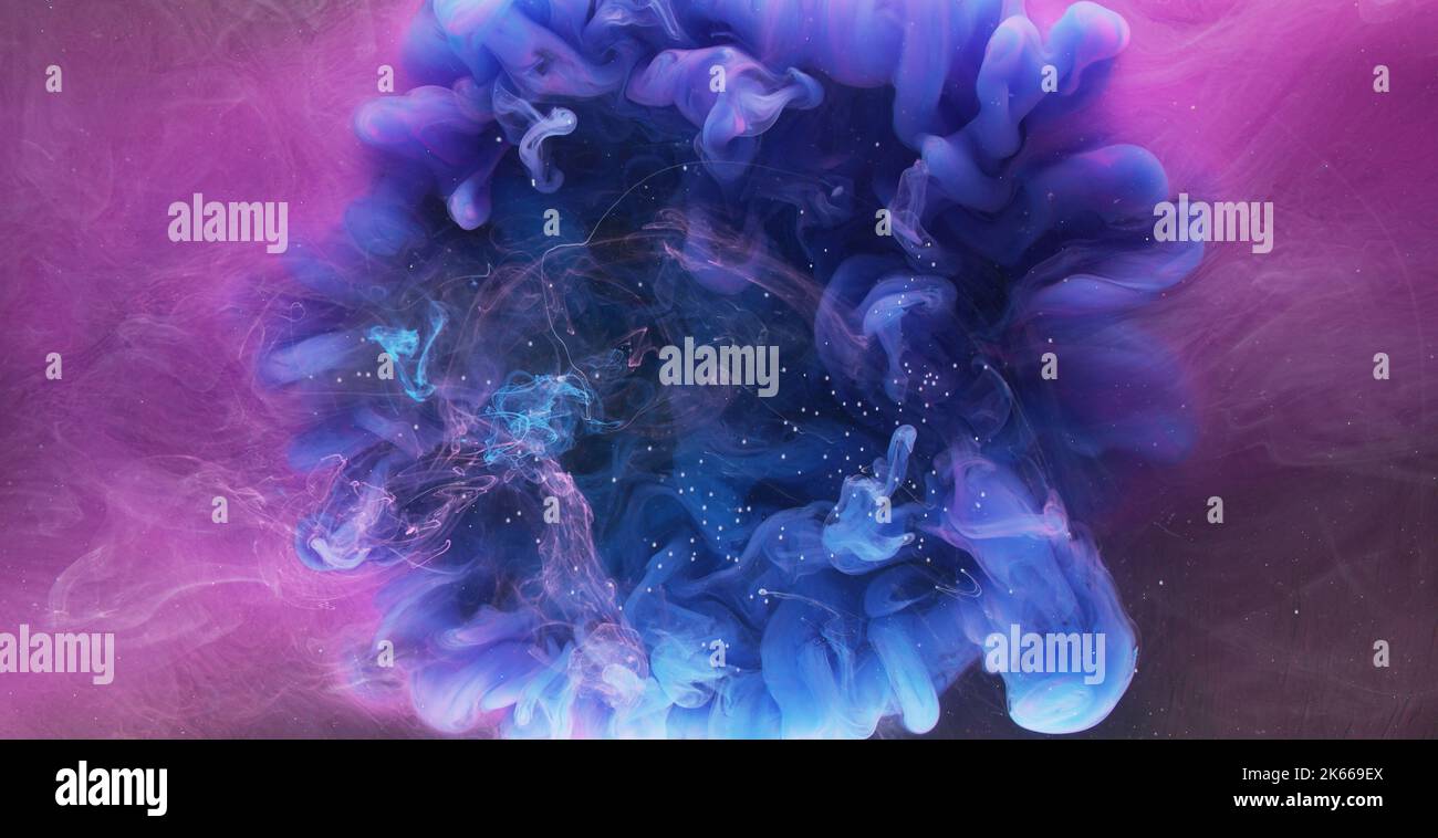 ink water drop color mist flow blue purple fume mix Stock Photo - Alamy