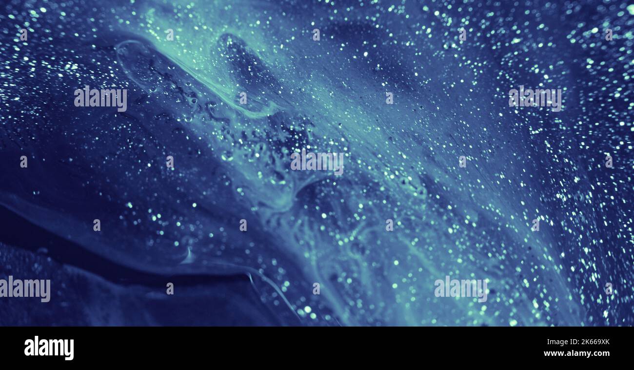 Glitter fluid acrylic paint motion blue liquid paint Stock Photo - Alamy