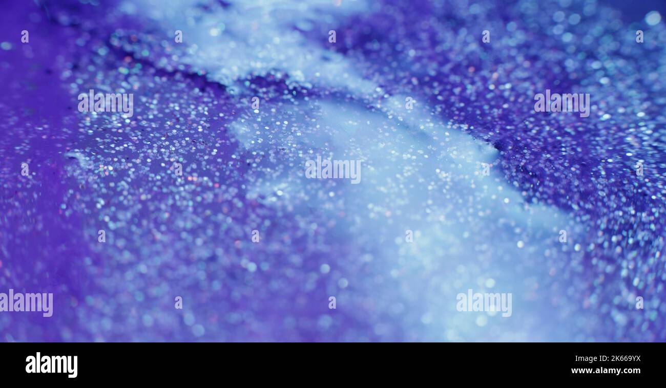 Glitter fluid acrylic paint motion blue liquid paint Stock Photo - Alamy