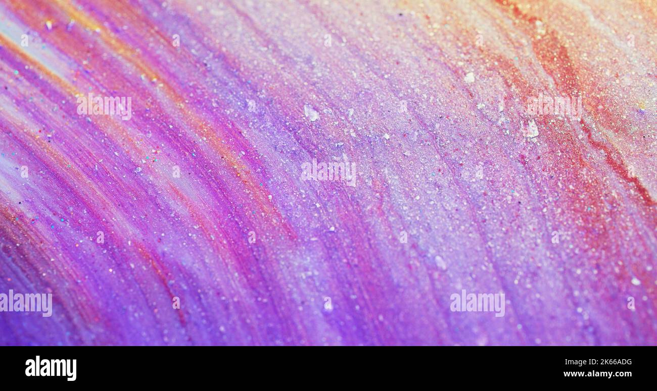 sparkling fluid texture glitter ink flow purple Stock Photo - Alamy